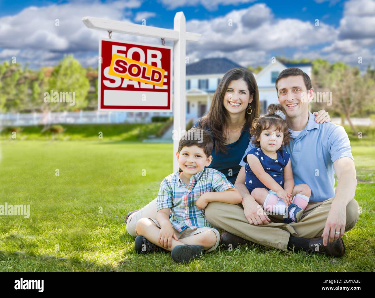 Young Family With Children In Front of Custom Home and Sold For Sale ...
