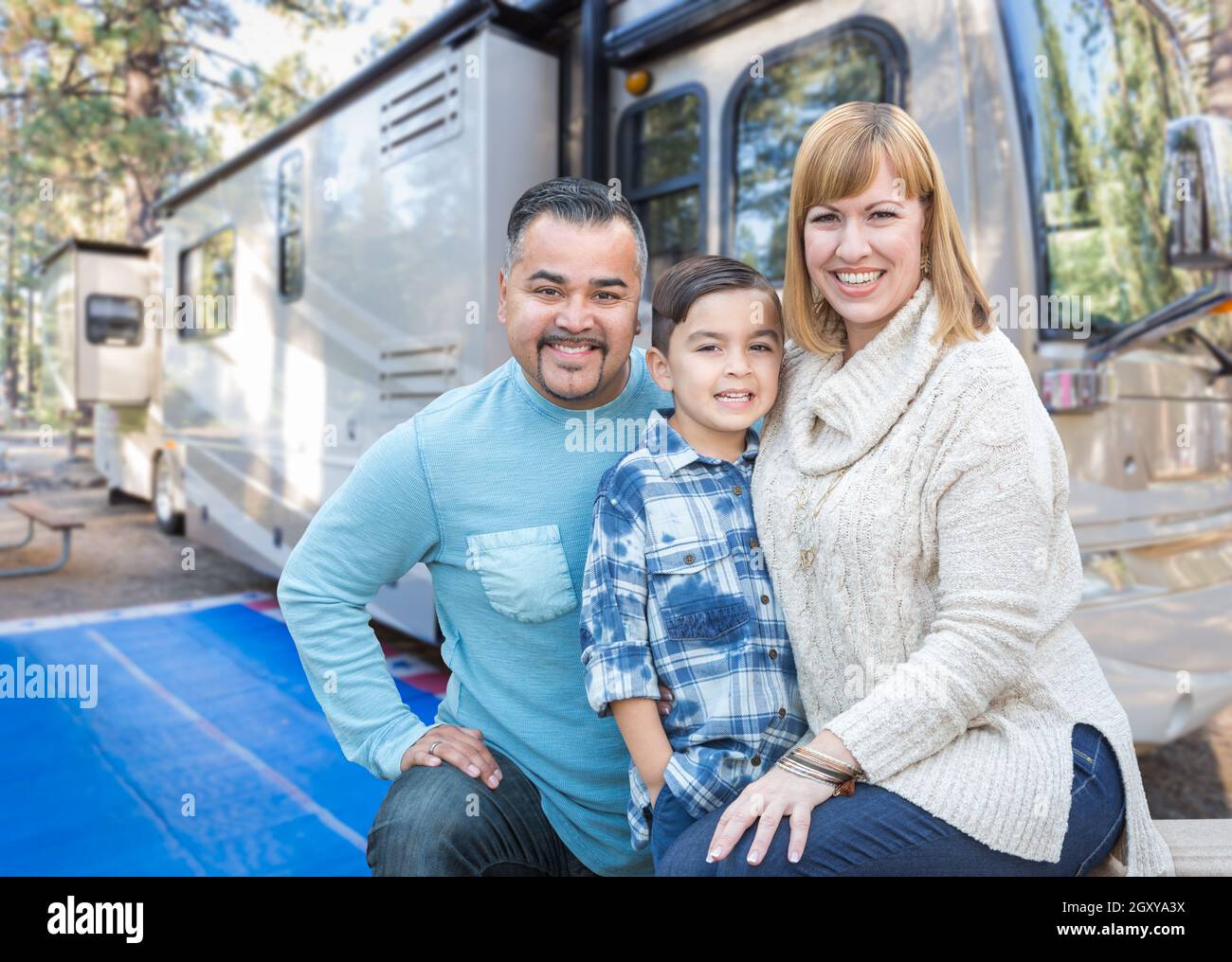 Happy Young Mixed Race Family In Front of Their Beautiful RV At The ...