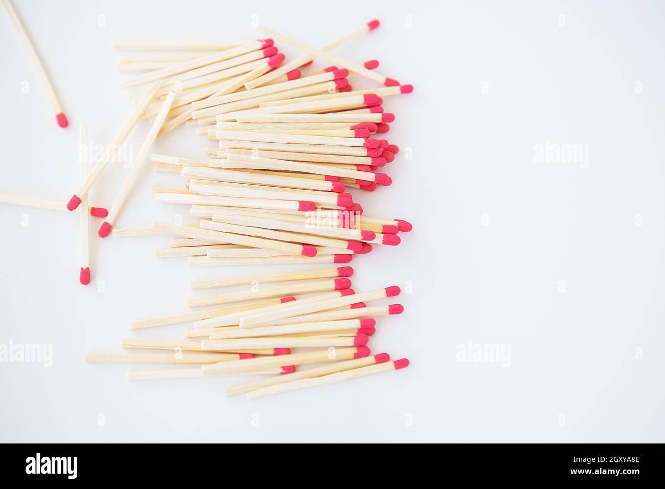 Long matches with a red head on a white background Stock Photo - Alamy