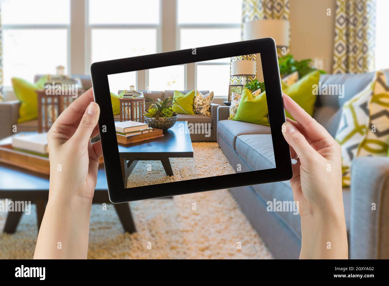 Female Hands Holding Computer Tablet In Room with Photo on Screen Stock ...