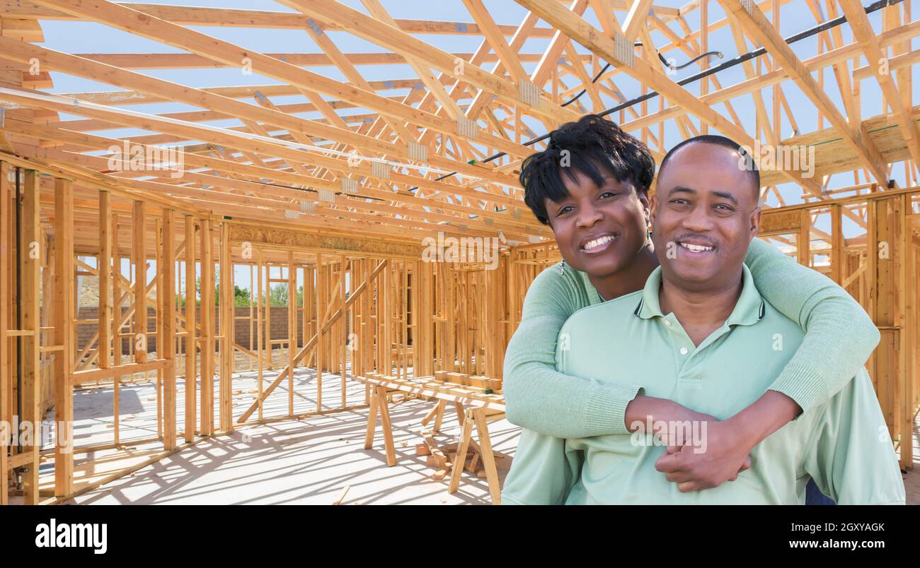 Happy African American Couple Inside Construction Framing of New House ...
