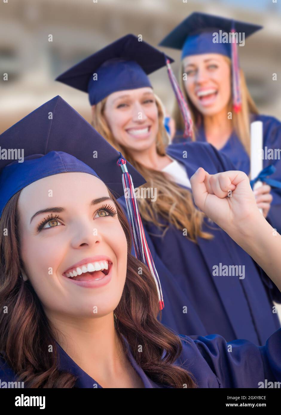 Happy Graduating Group of Girls In Cap and Gown Celebrating on Campus ...