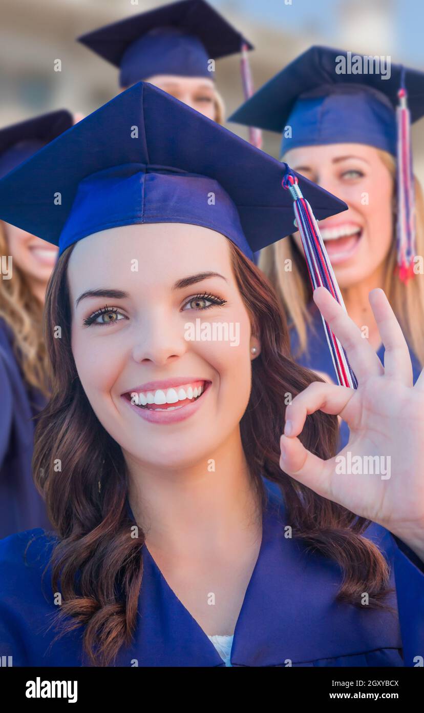 Happy Graduating Group of Girls In Cap and Gown Celebrating on Campus ...