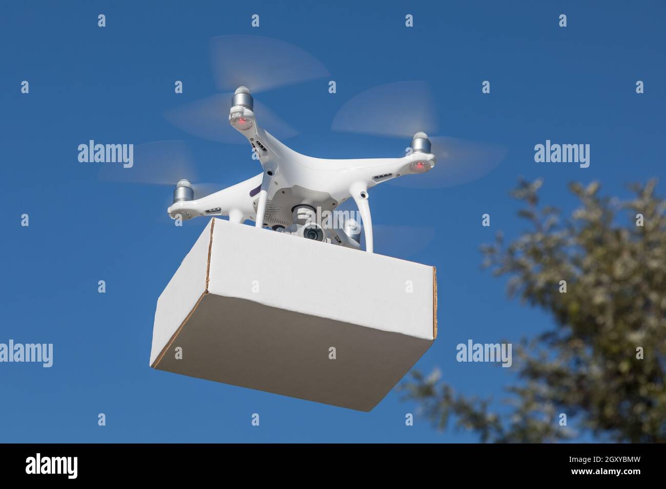 Unmanned Aircraft System (UAS) Quadcopter Drone Carrying Blank Package ...