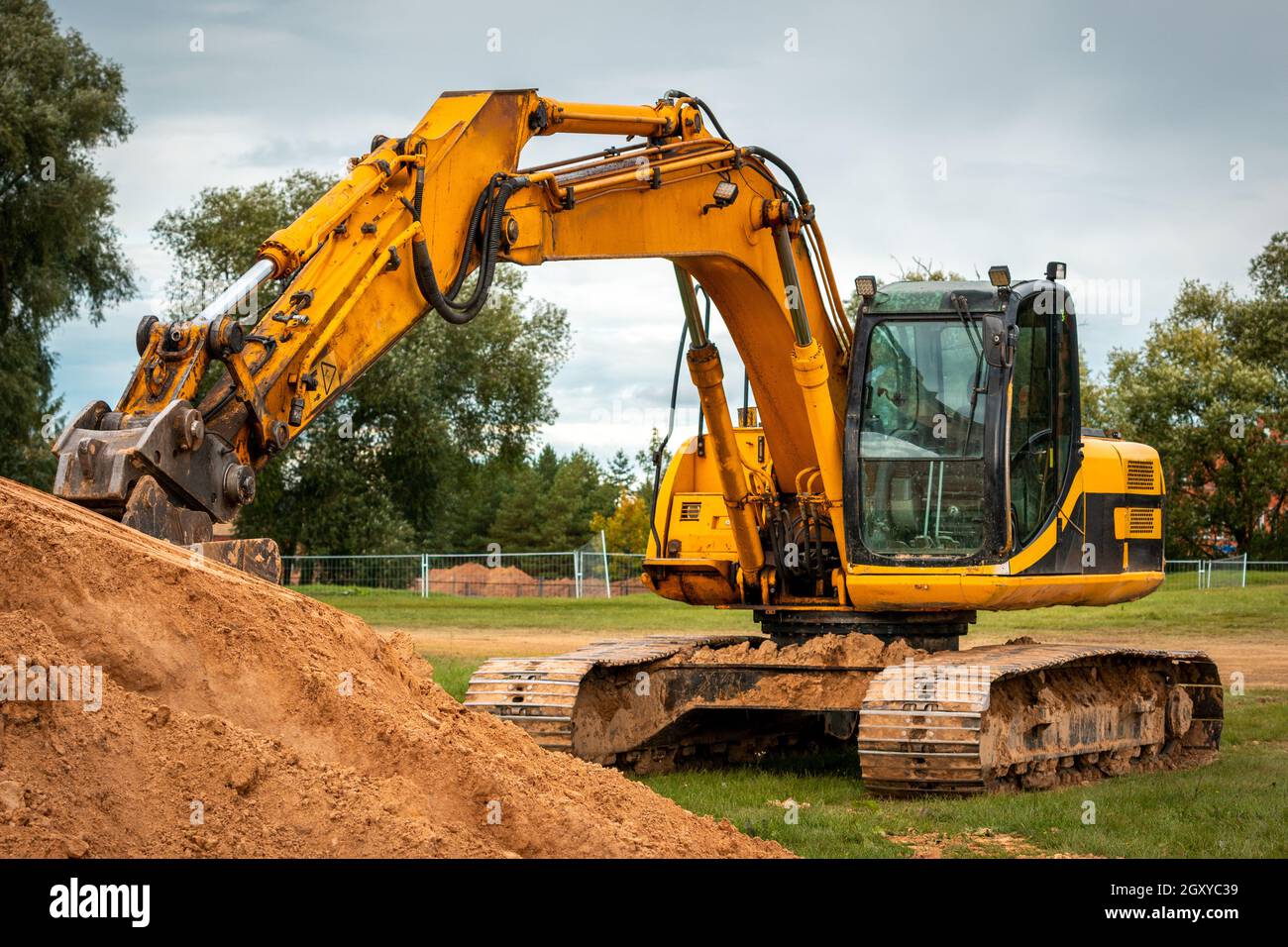 Excavator during earthmoving at construction site. Сonstruction ...