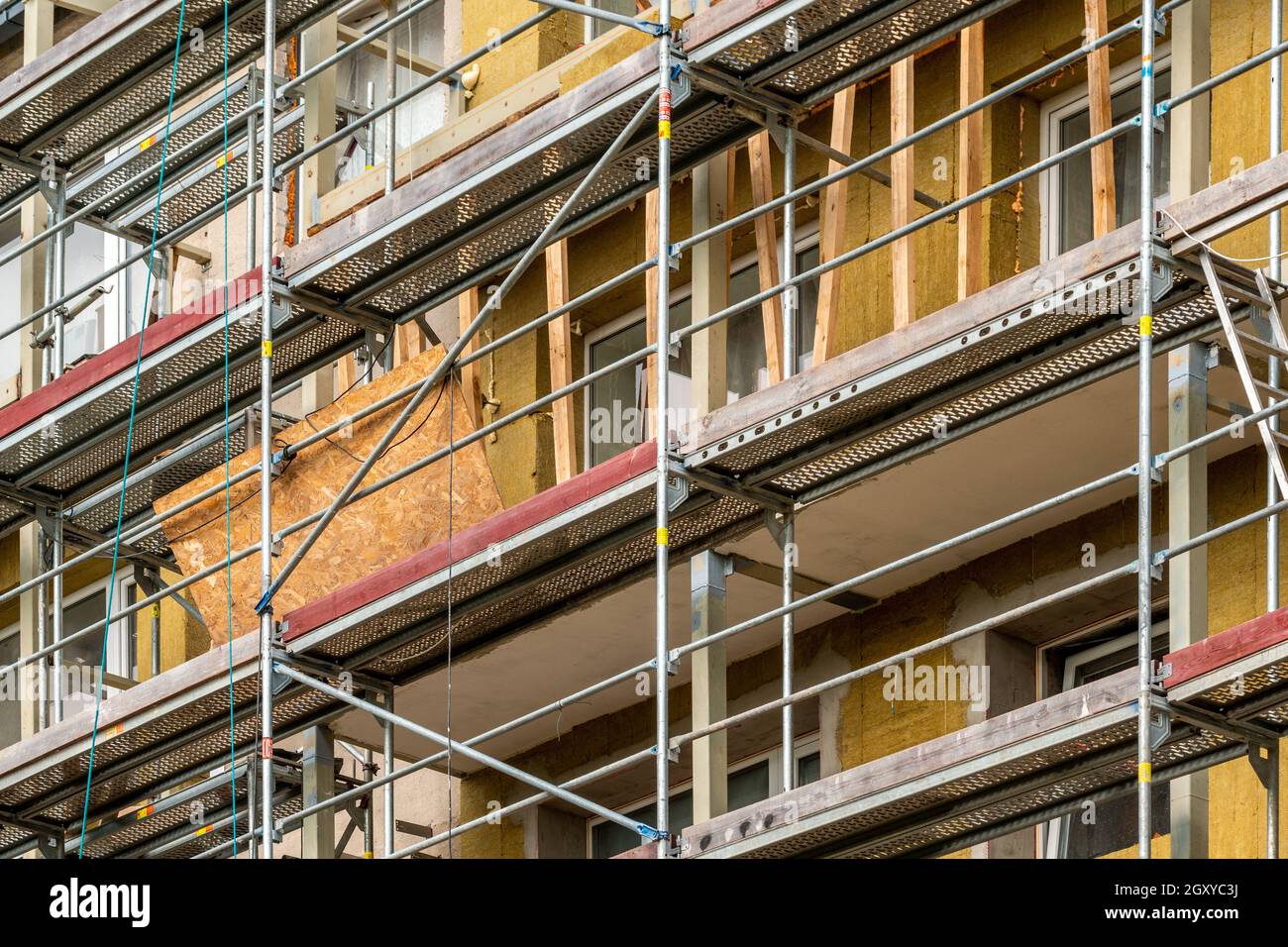 Renovation of the facade of a multistorey building.Scaffolding standing ...