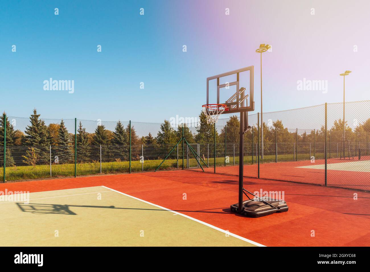 Basketball hoop and court with nature background Stock Photo - Alamy