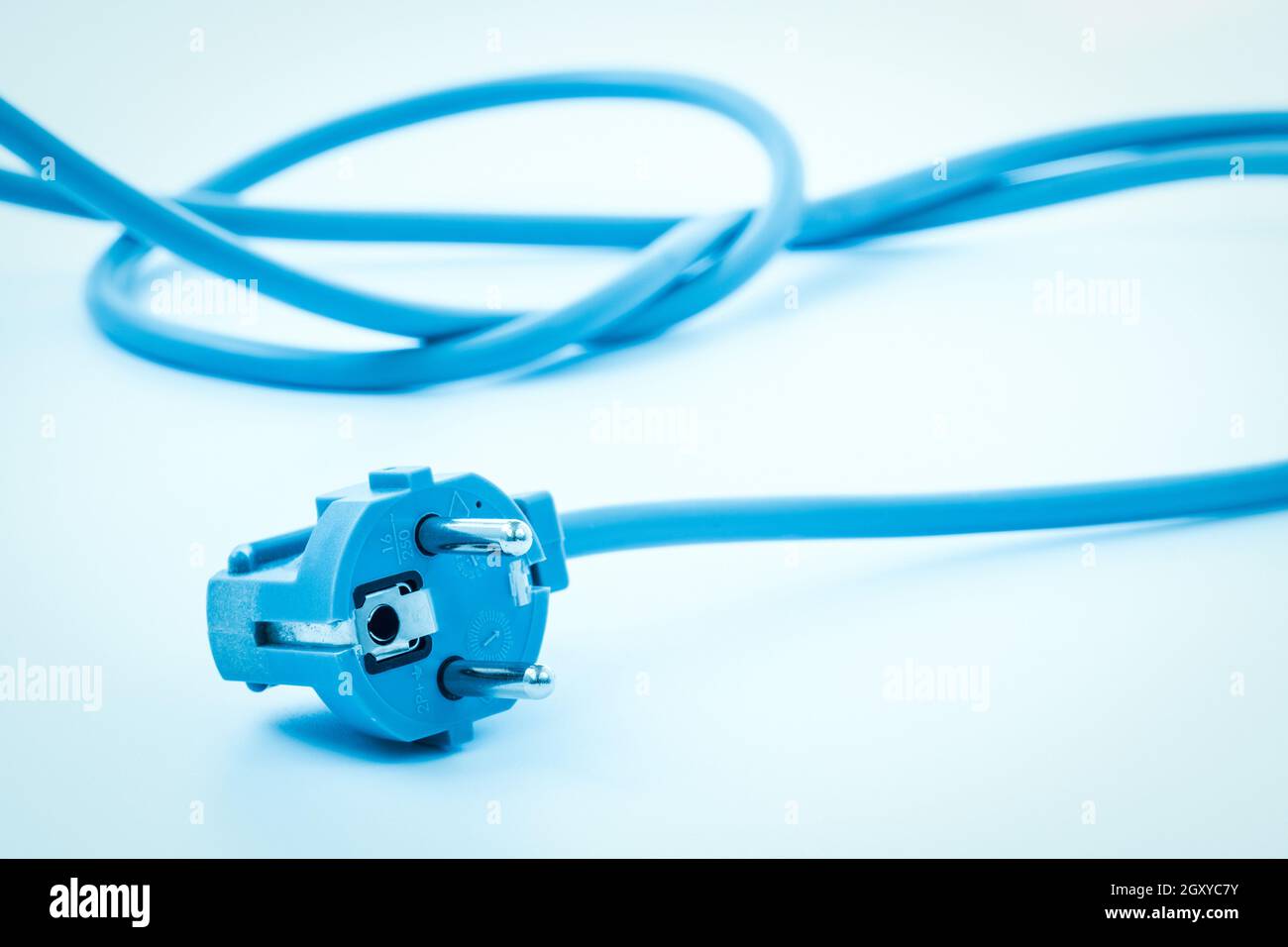Plug of power supply "230V" with a long cord. Blue toned image Stock ...