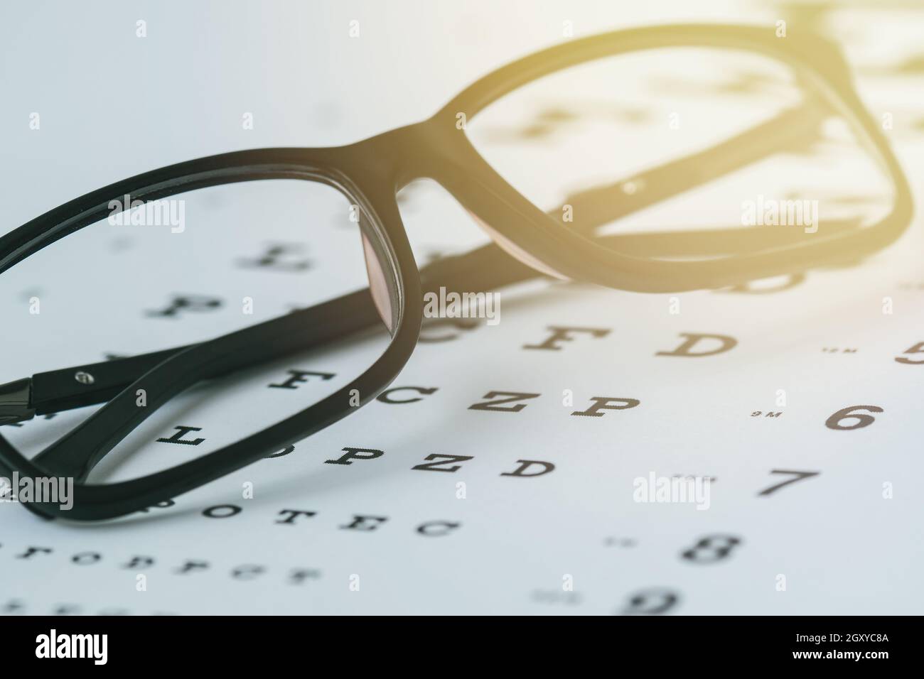 Modern reading glasses on the eye sight test chart Stock Photo - Alamy