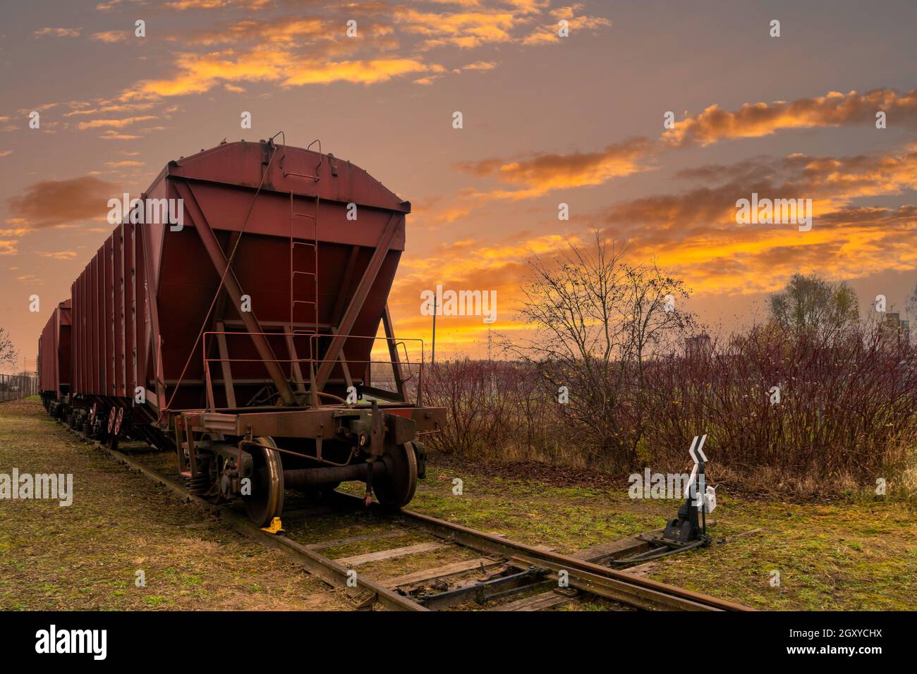 Railway containers with bulk materials. The locomotive pulls a large ...