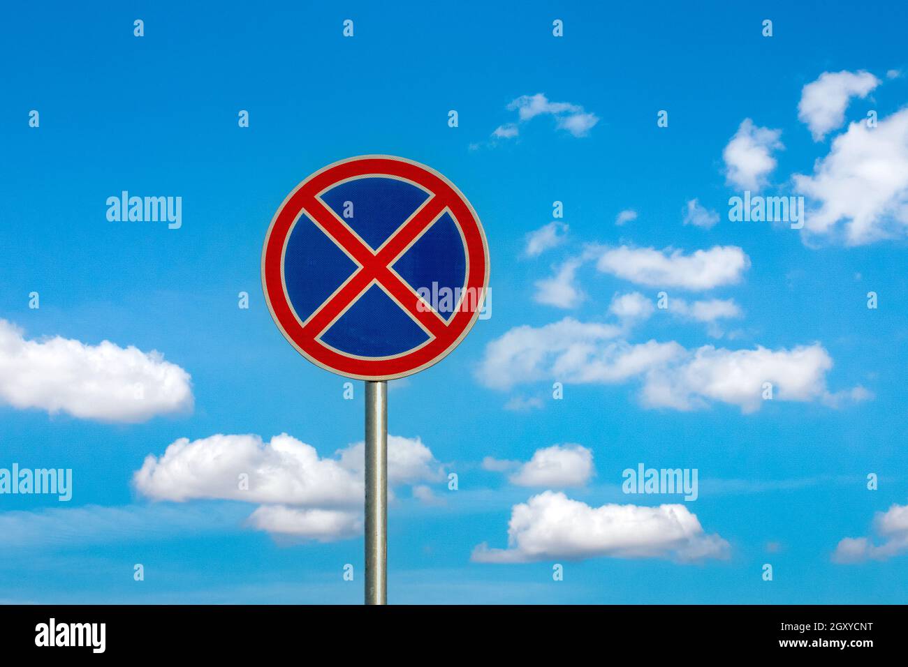 No parking traffic sign on the cloudy sky background.Do not stop ...