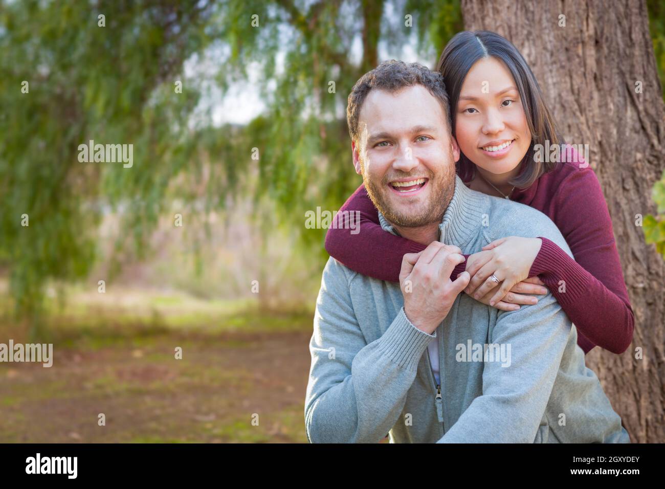 Mixed Race Caucasian and Chinese Couple Portrait Outdoors Stock Photo ...