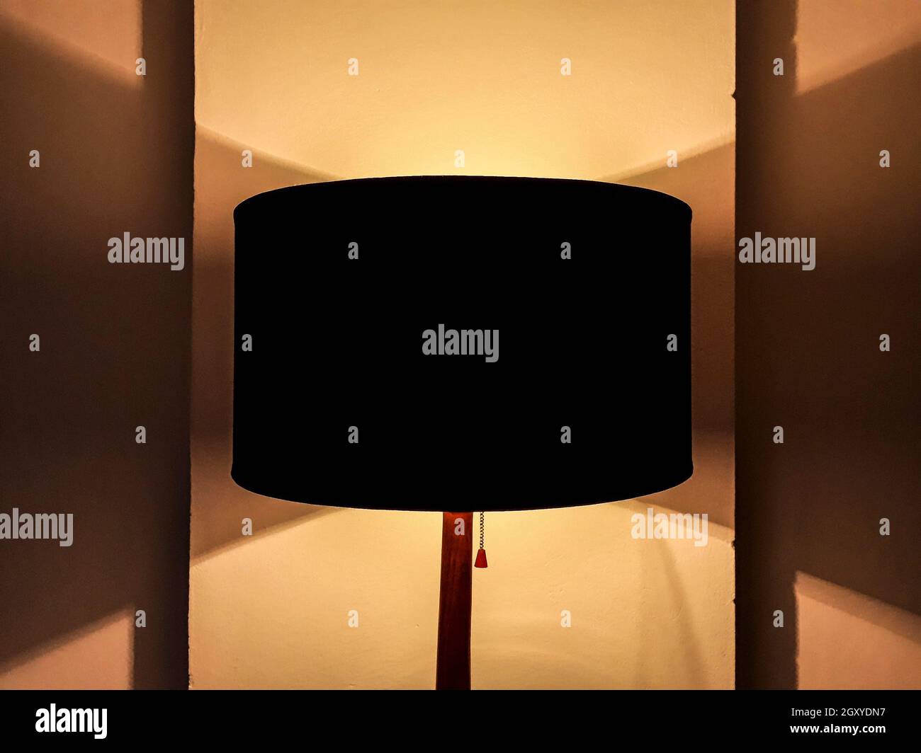 Front view black lamp illuminating interior room Stock Photo - Alamy