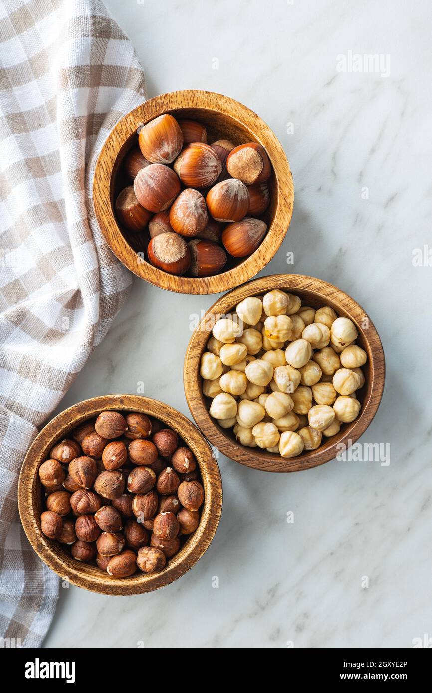 Peeled roasted hazelnut kernels in bowl. Top view Stock Photo - Alamy