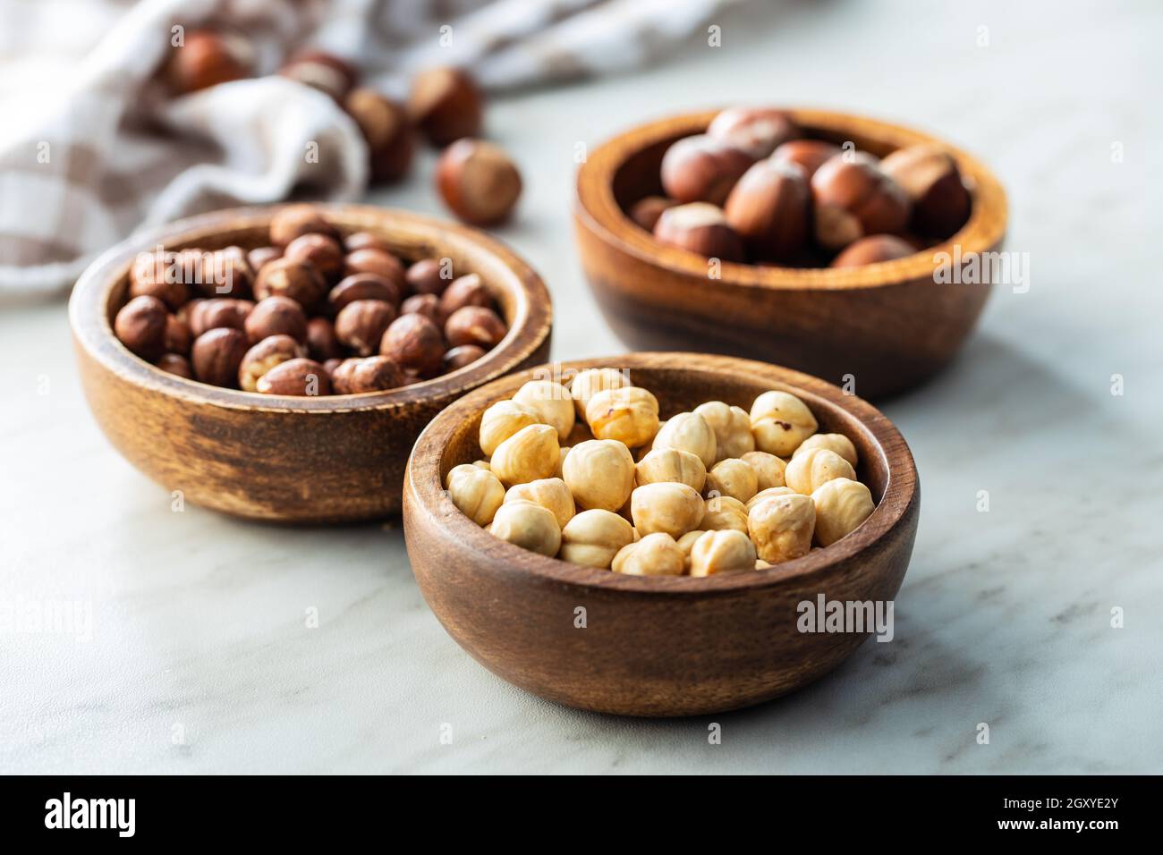 Peeled roasted hazelnut kernels in bowl Stock Photo - Alamy