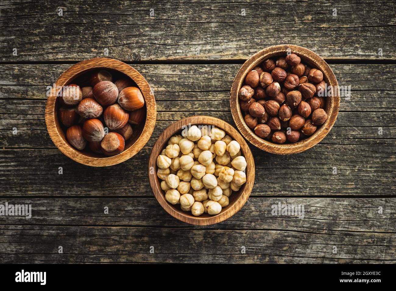Peeled roasted hazelnut kernels in bowl. Top view Stock Photo - Alamy