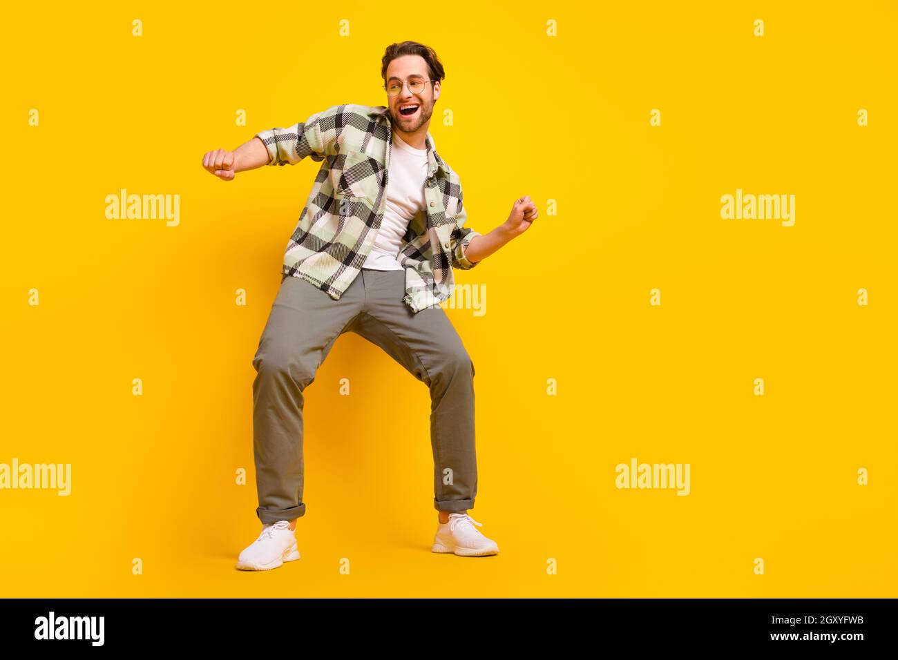 Full body photo of young cheerful man happy positive smile dance music ...