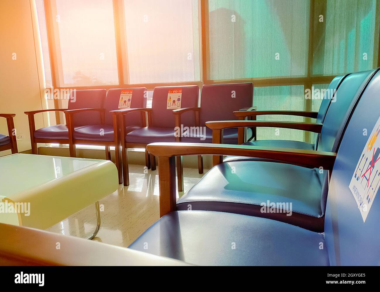 Social distancing. Empty dark blue chair with gap for social distance ...