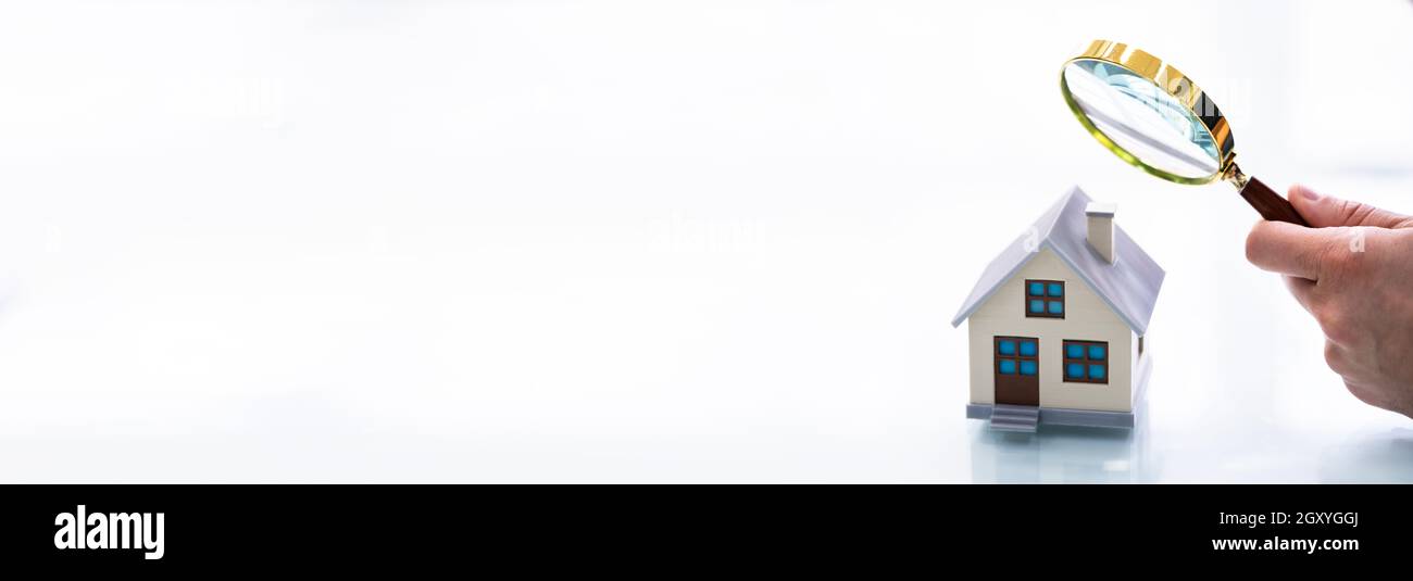 Real Estate House Inspector Checking Property Using Magnifying Glass ...