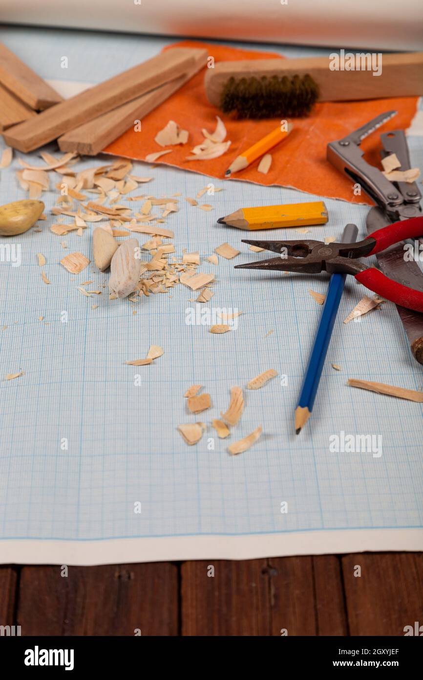 Handmade wooden fishing tacles graph paper background with tools and ...