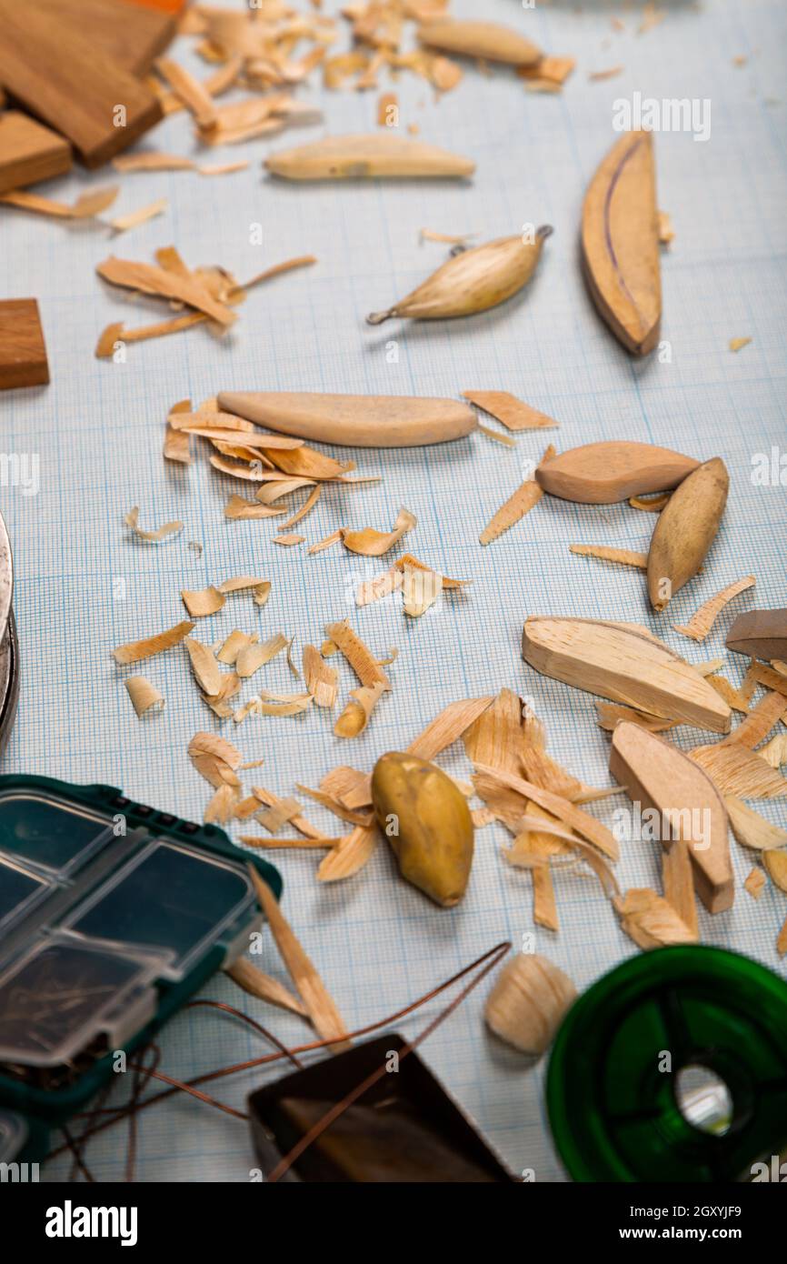 Handmade wooden fishing tacles graph paper background with tools and ...