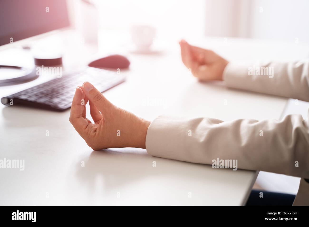 Healthy Yoga Exercise In Office Chair At Workplace Stock Photo - Alamy