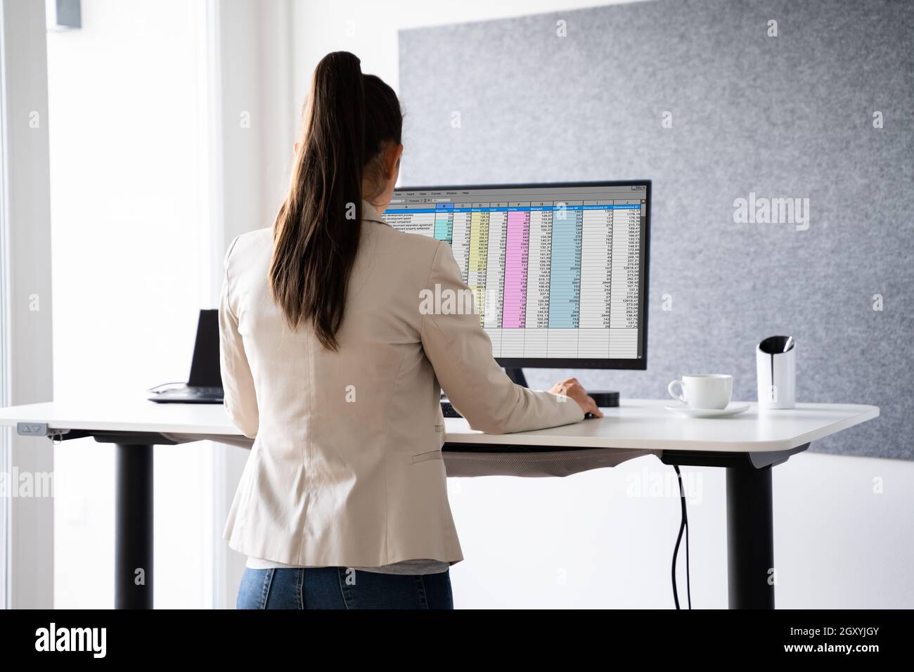 Adjustable Height Office Desk. Working While Standing Stock Photo - Alamy