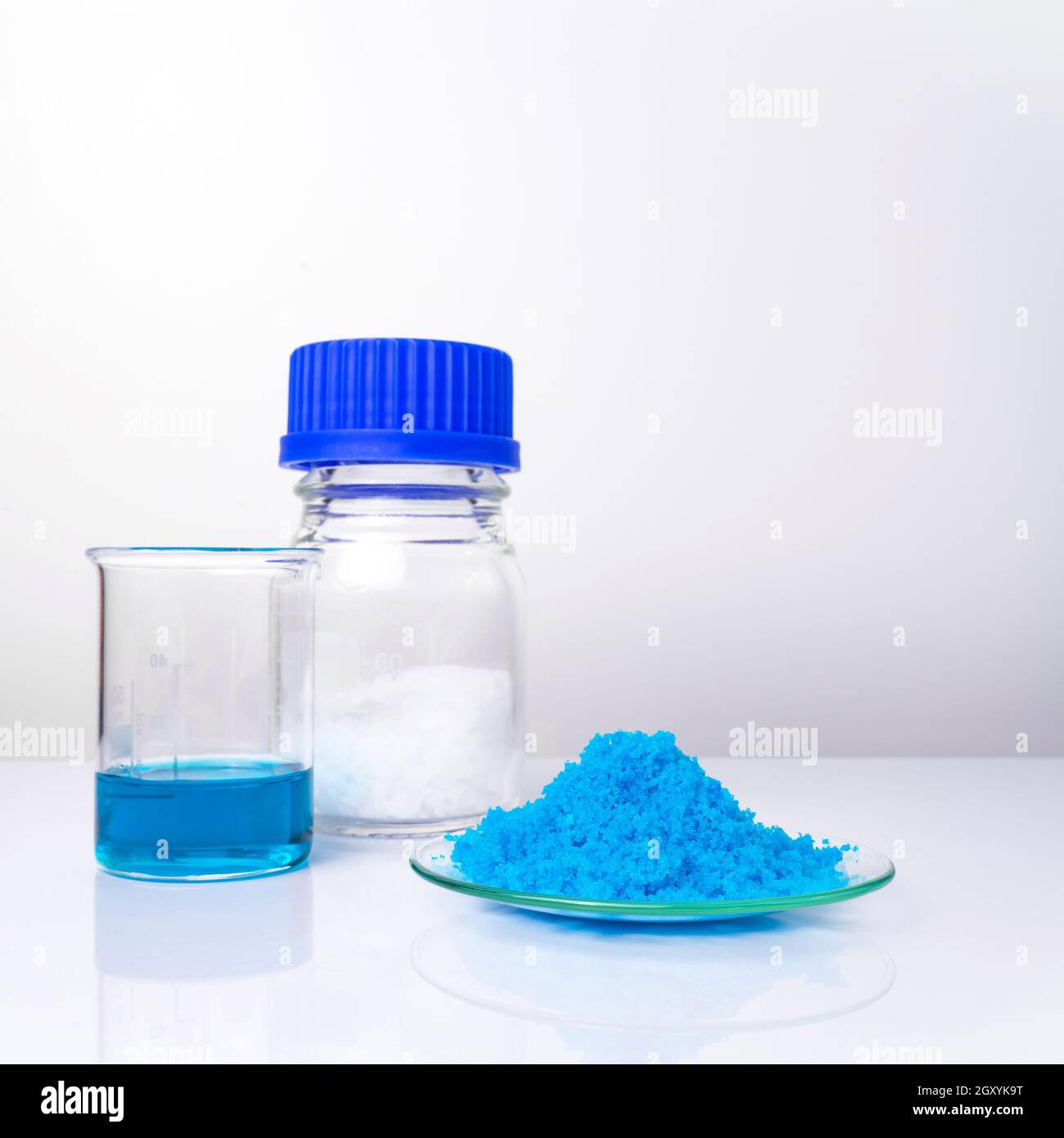 Inorganic chemical on white laboratory table. Copper(II) sulfate ...