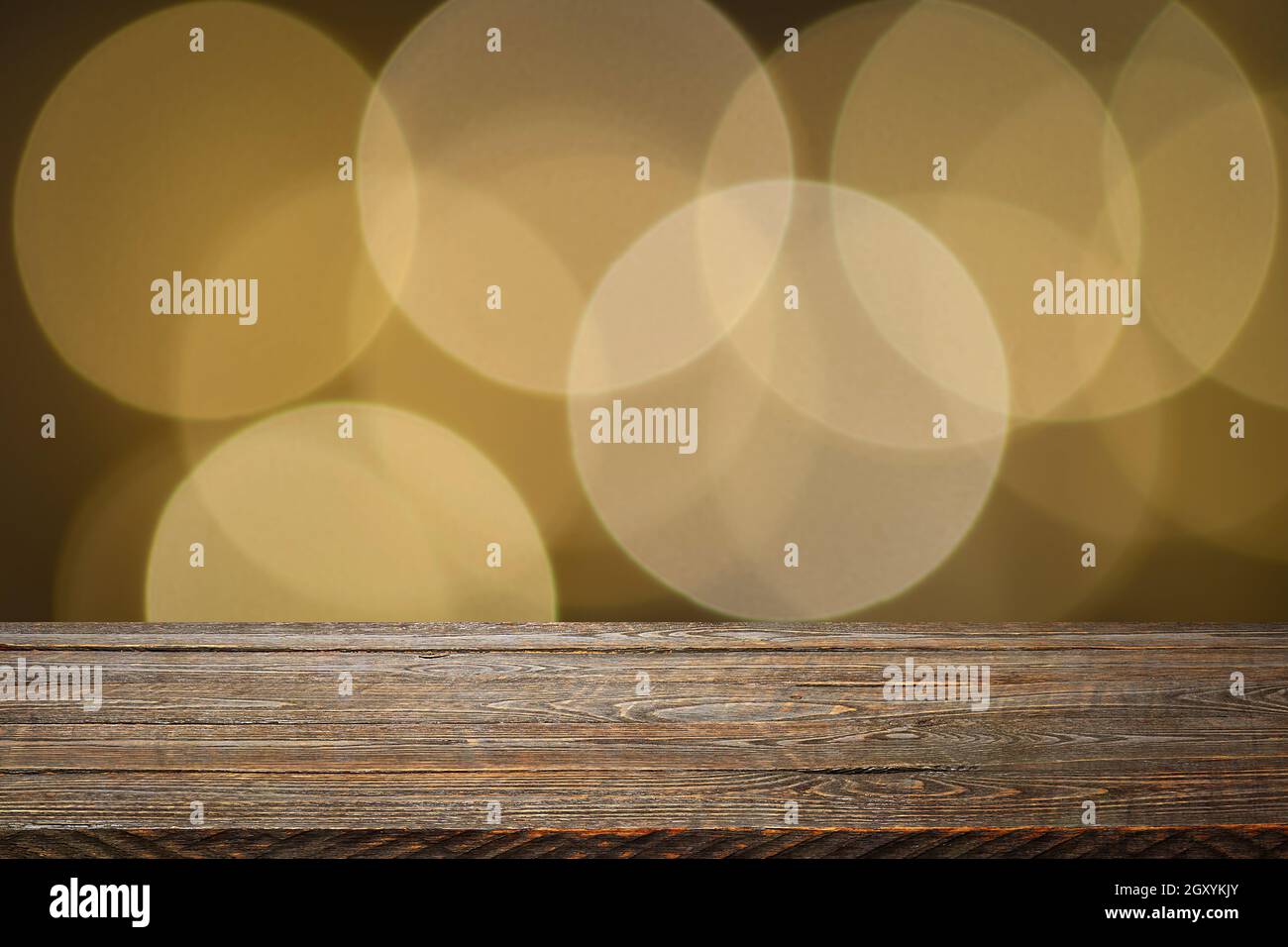 The background is an empty wooden board and a wall of blurred bokeh ...