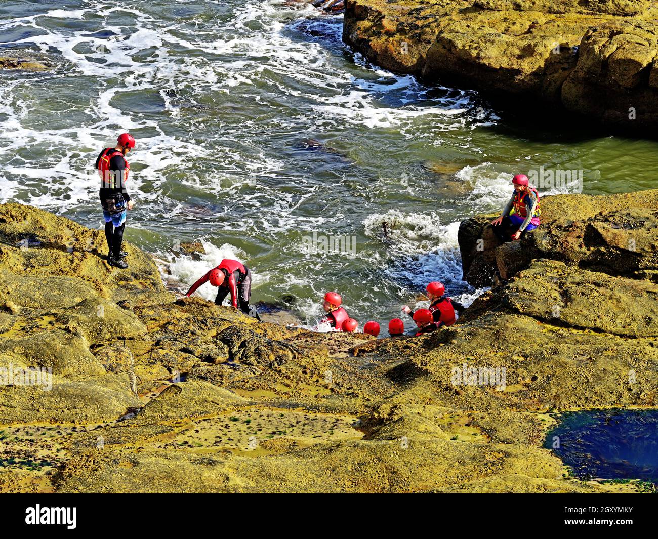 Adults learning coastal tidal walking and sea survival at Cullercoats ...