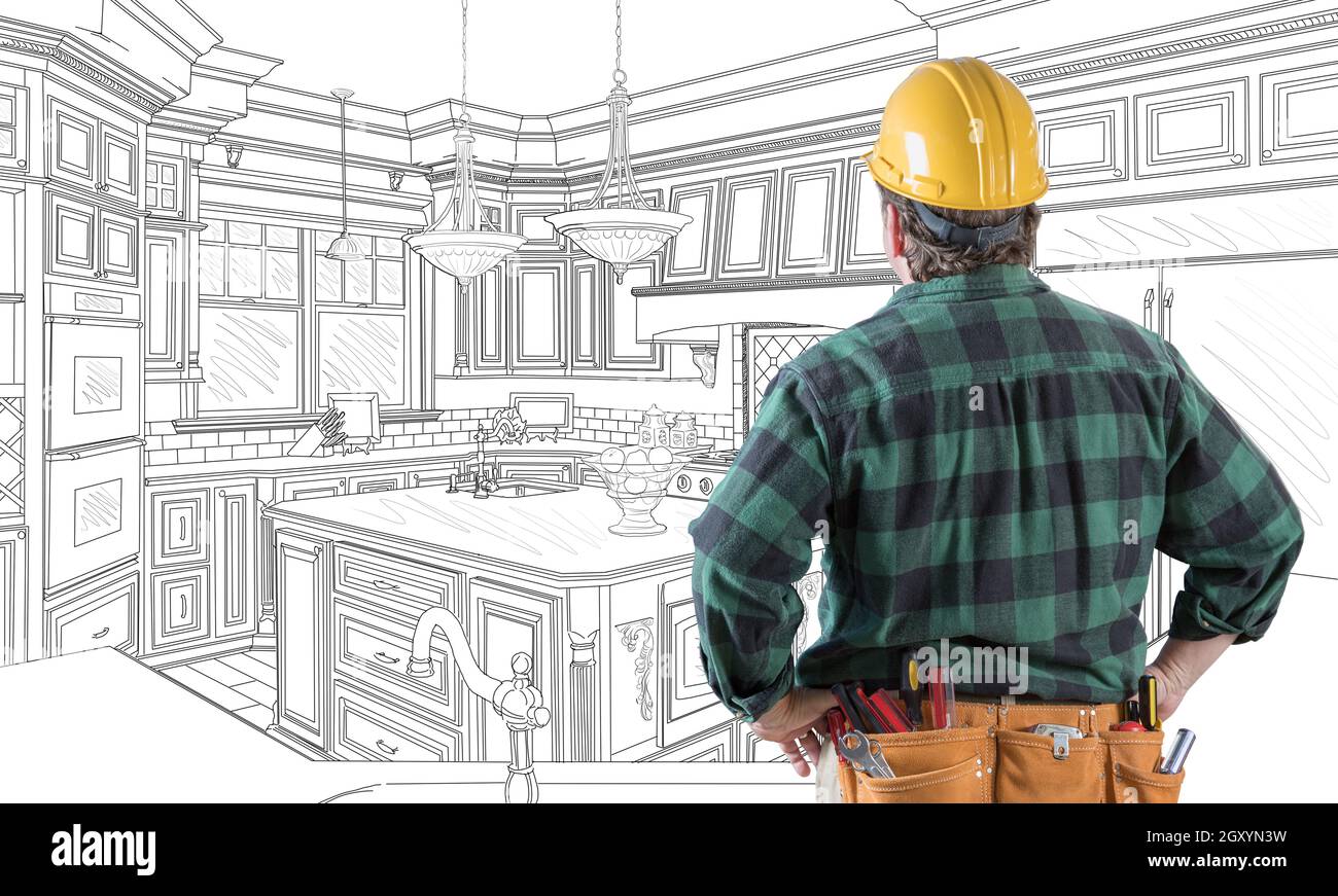 Male Contractor with Hard Hat and Tool Belt Looking At Custom Kitchen ...