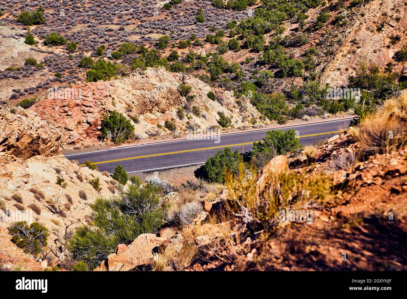 Road through desert slopes of sand and rock Stock Photo - Alamy