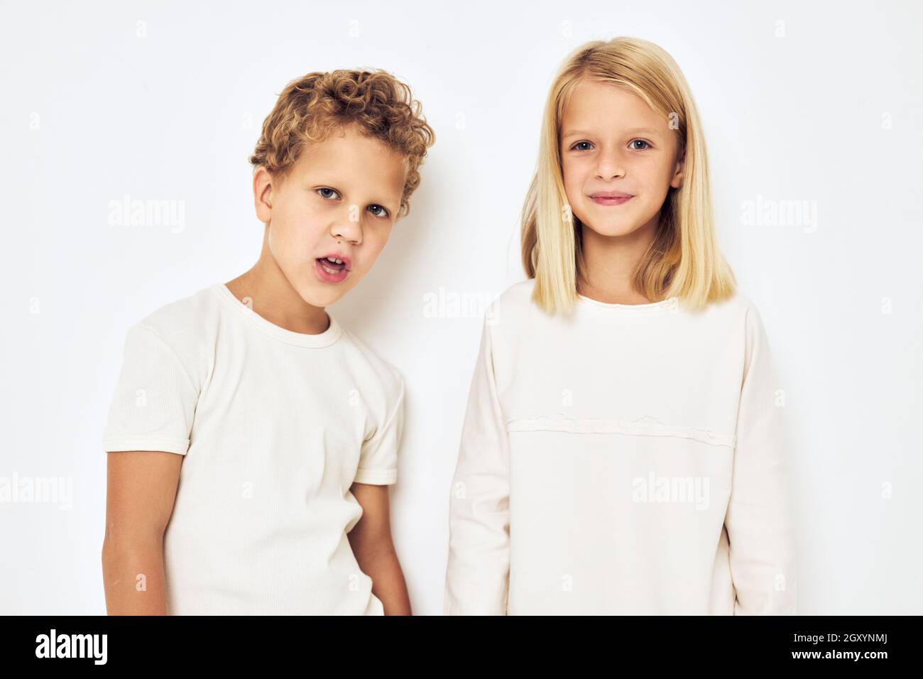 Two preschool children boy and girl little cheerful cheery friends ...