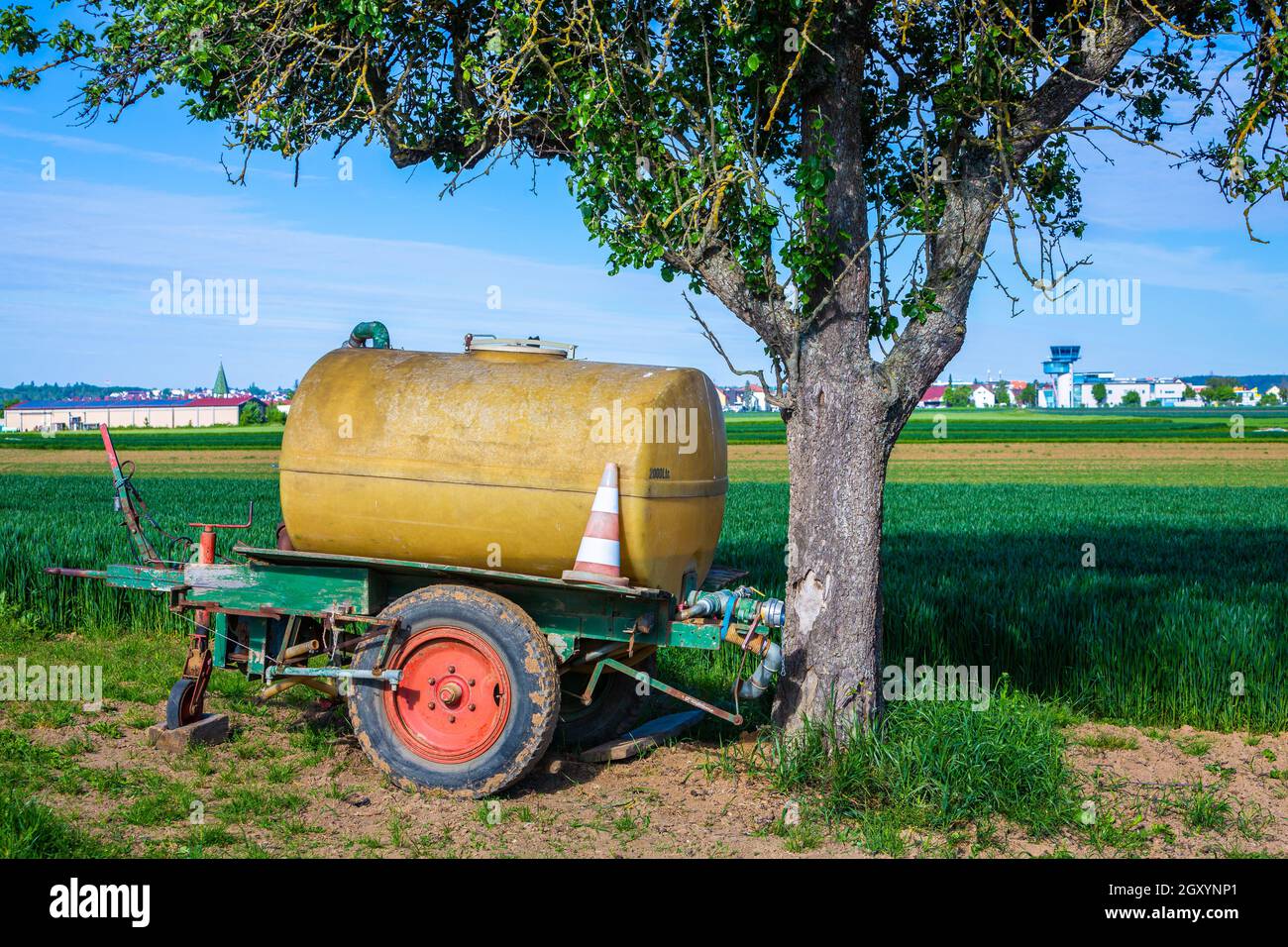 water tank for artificial watering on a farm Stock Photo - Alamy