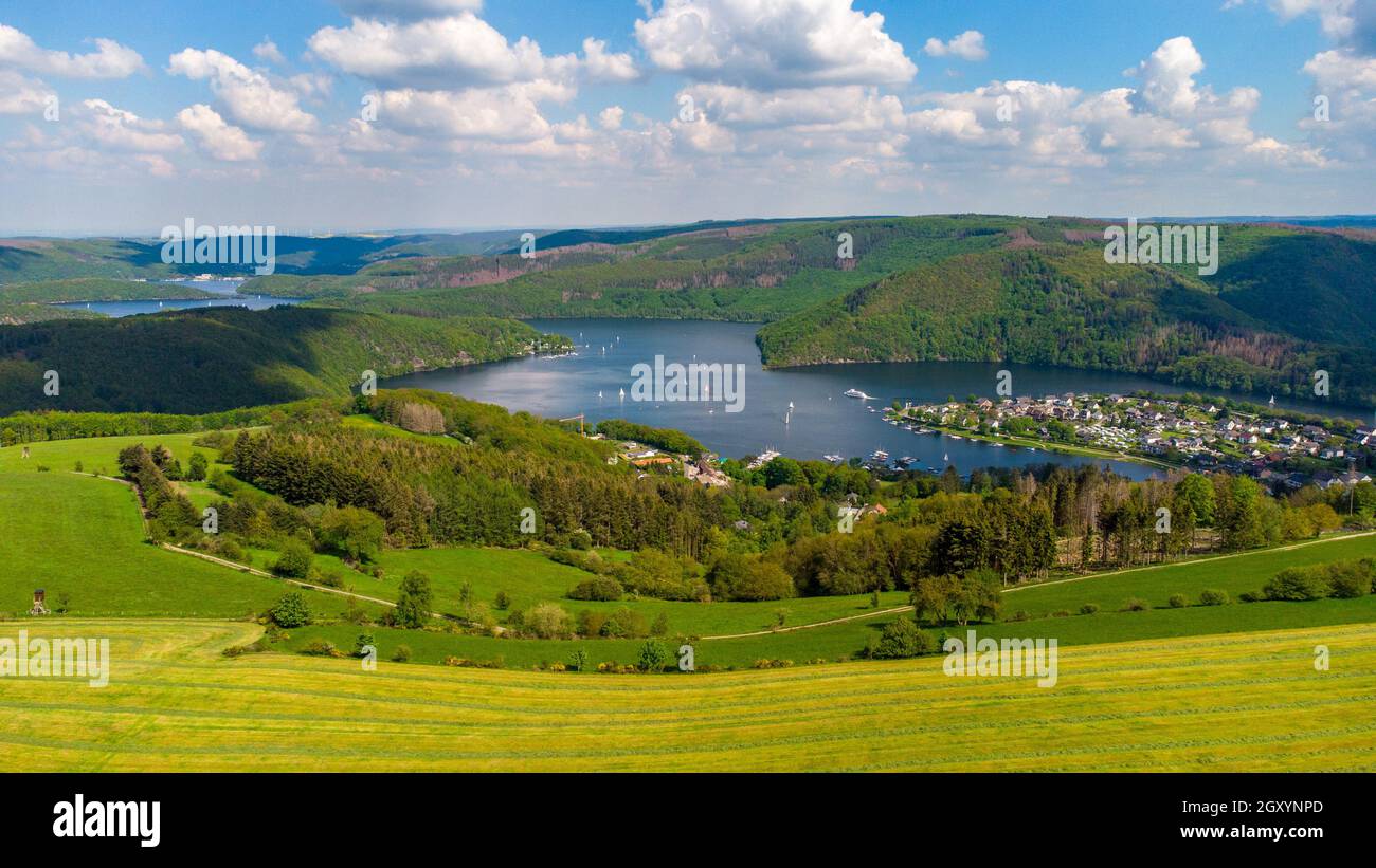 Aerial view of the Rursee in the Eifel region, Germany with farmland in ...