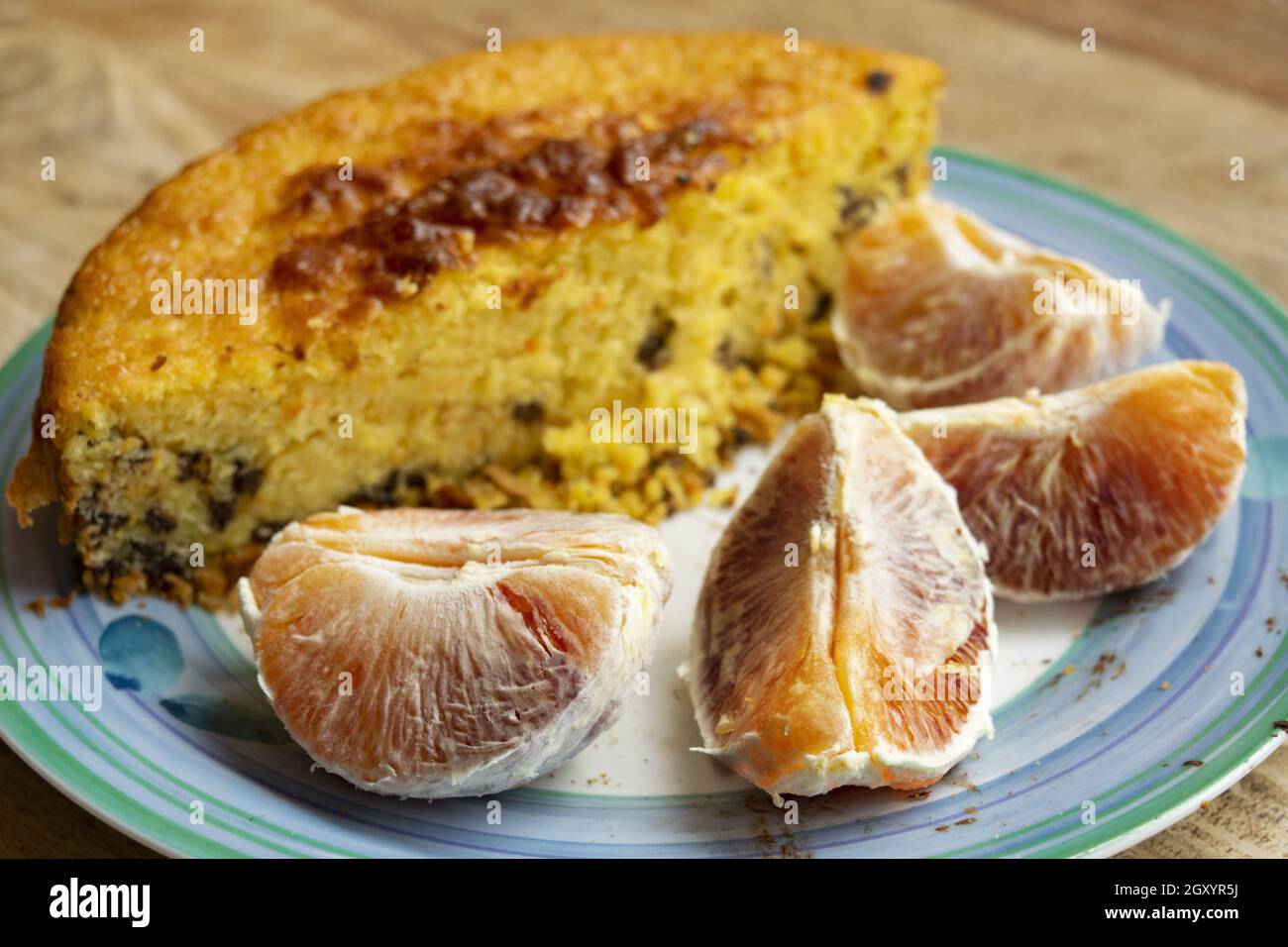 piece of homemade orange sponge cake made with fresh orange Stock Photo ...