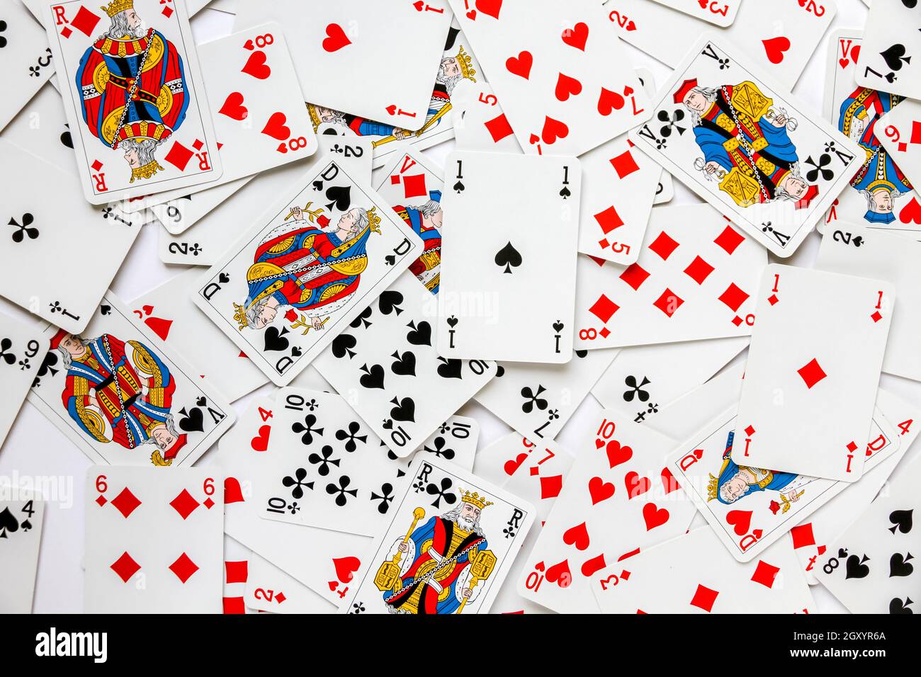 Classic playing card game laid out on a table. White background Stock ...