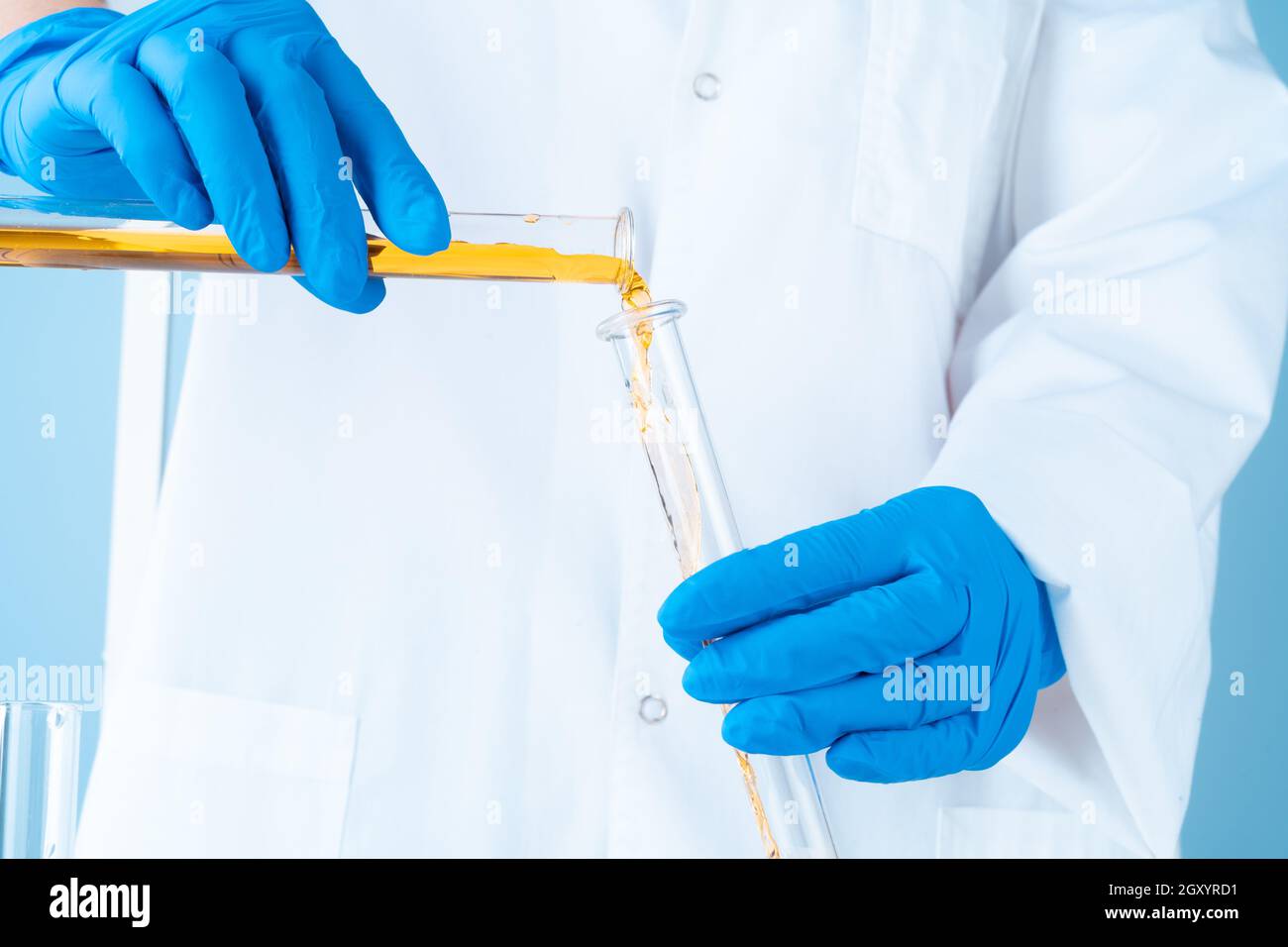 Scientific experiments in a chemistry lab. Color liquids and test tube ...