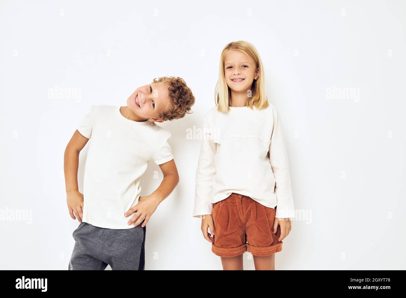 Two preschool children boy and girl little cheerful cheery friends fun ...