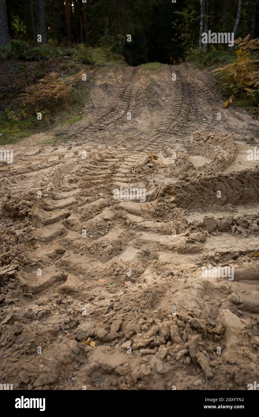 Wheel trail on sandy ground from large transport, tractor on ...