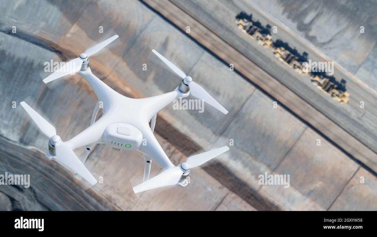 Unmanned Aircraft System (UAV) Quadcopter Drone In The Air Over ...