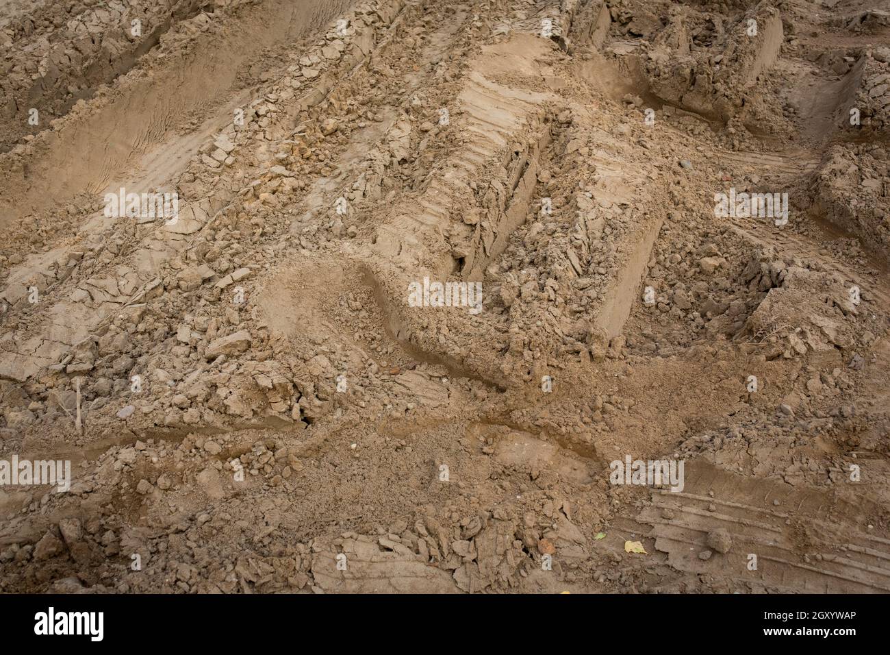 Wheel trail on sandy ground from large transport, tractor on ...