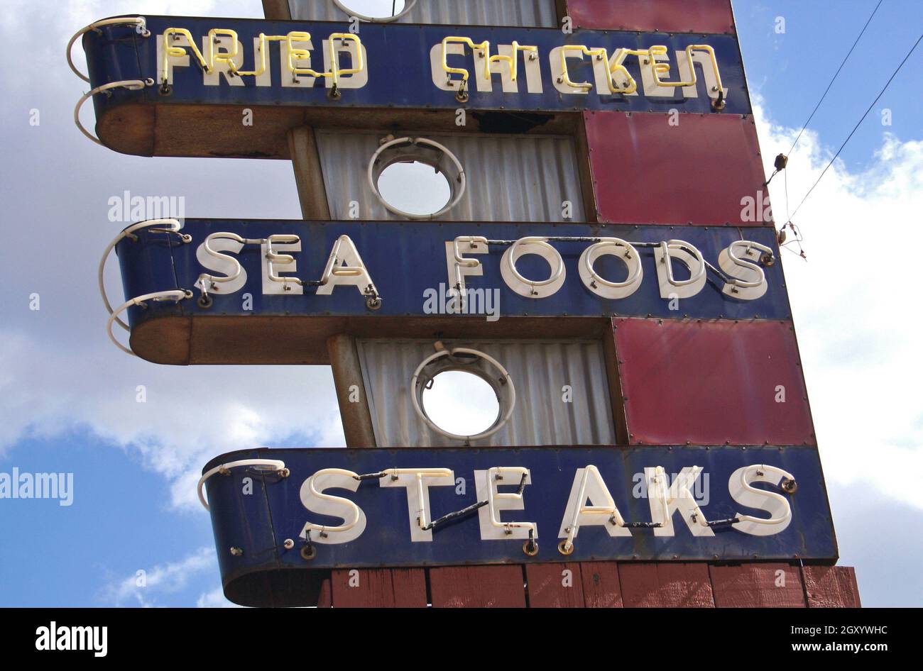 Restaurant Sign on Building Roof Stock Photo - Alamy