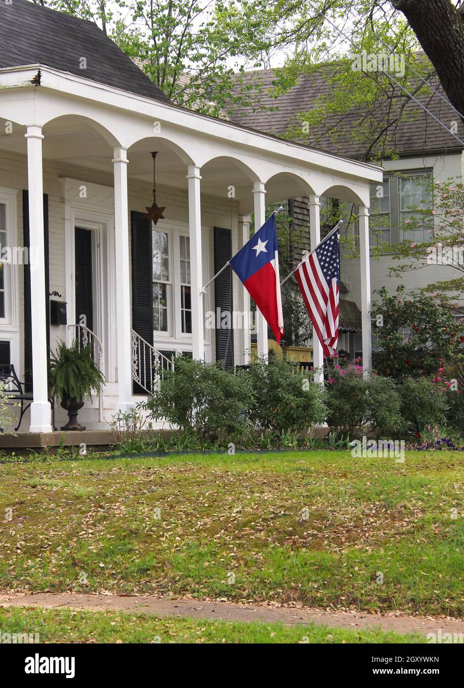 White colonial home american flag hi-res stock photography and images ...