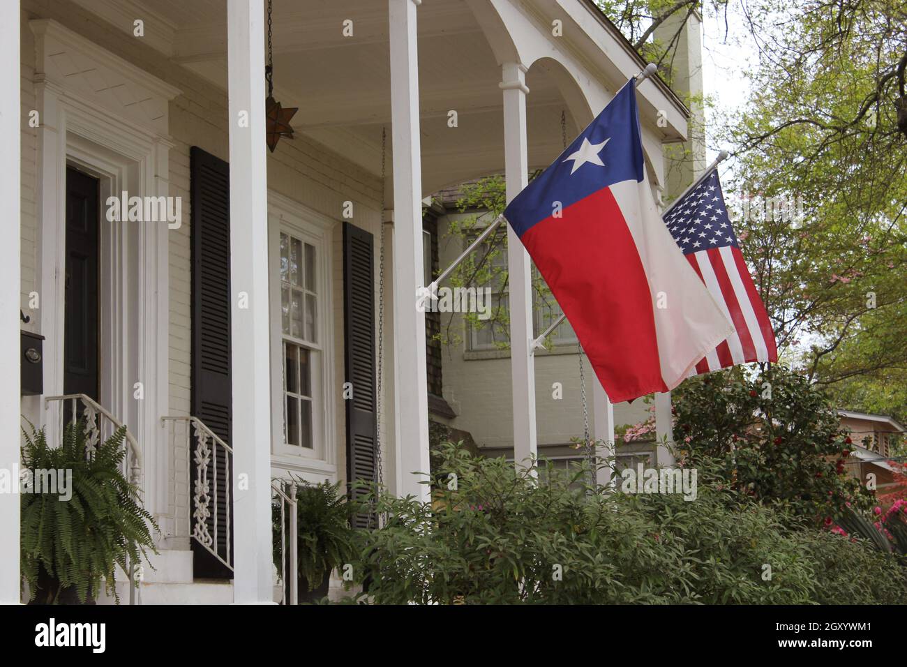 White colonial home american flag hi-res stock photography and images ...