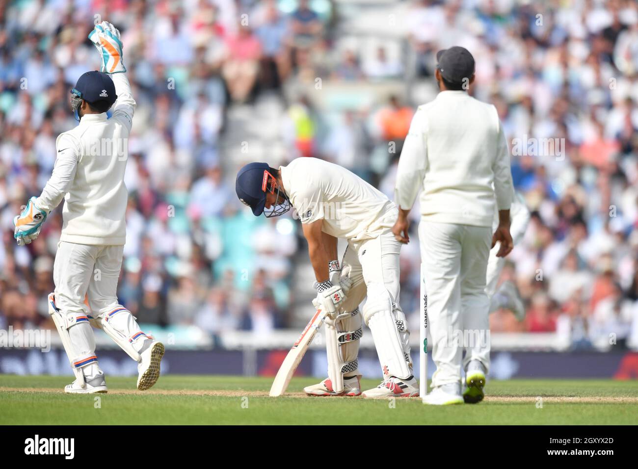 England’s Alastair Cook reacts after losing his wicket for the final ...