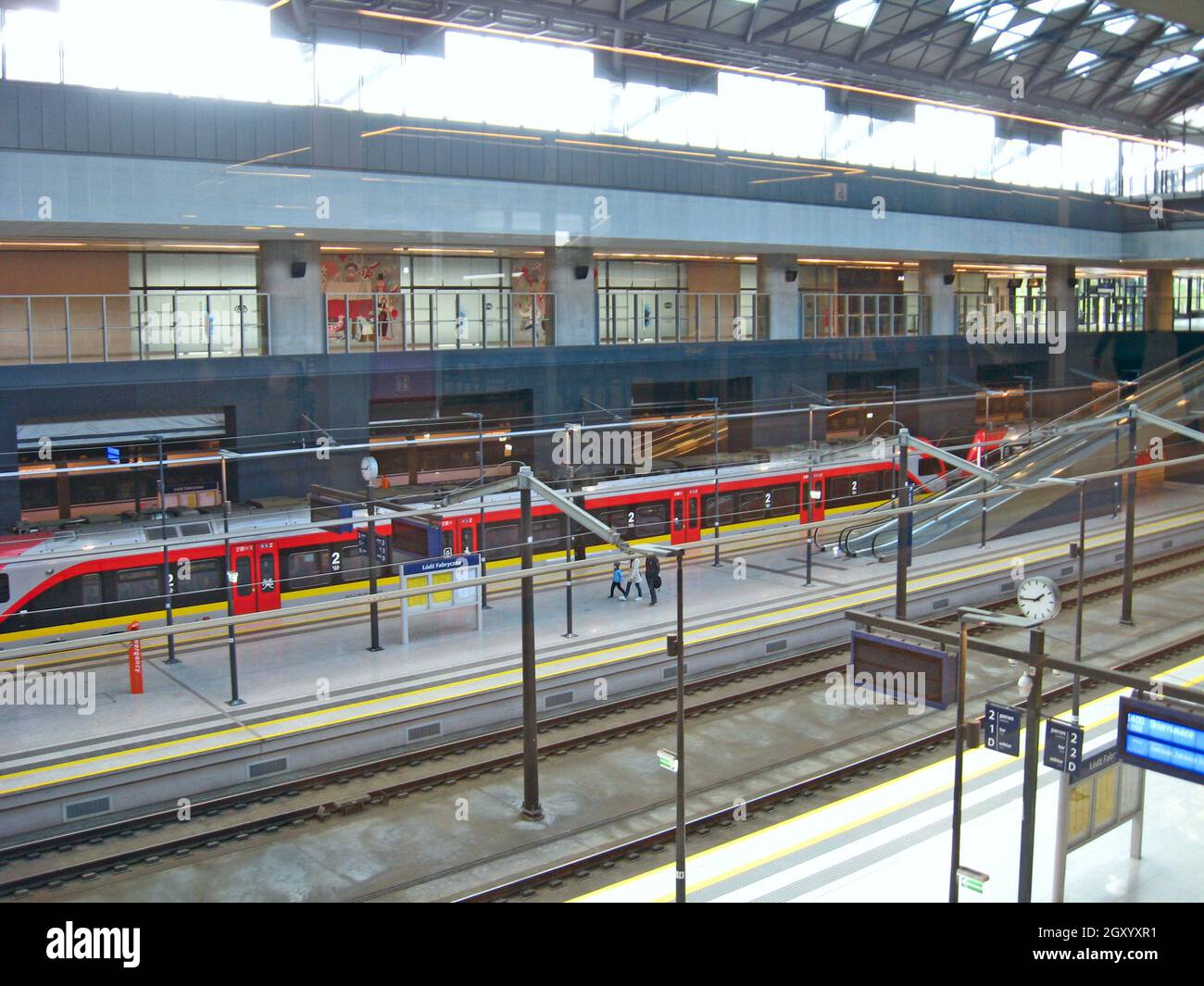 Electric train leaving station in subway in evening. Train leaving ...