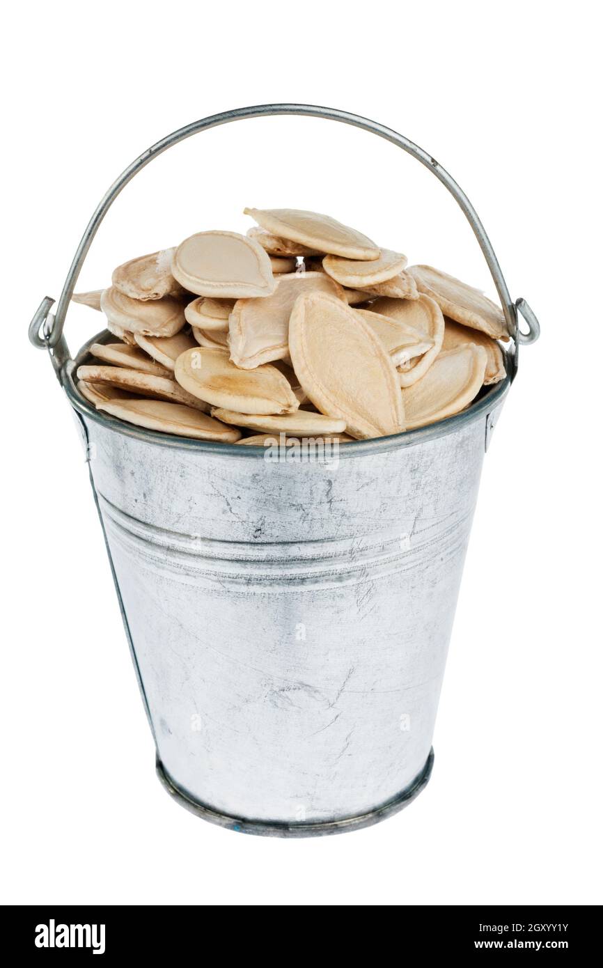 Bucket with pumpkin seeds, isolated on white background Stock Photo - Alamy