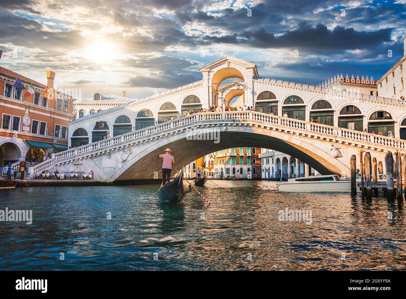 Traditional Gondola Near World Famous Canal Grande And Rialto Bridge