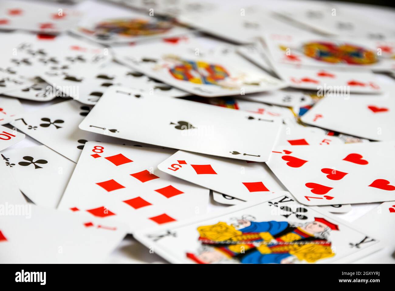 Classic playing card game laid out on a table. White background Stock ...